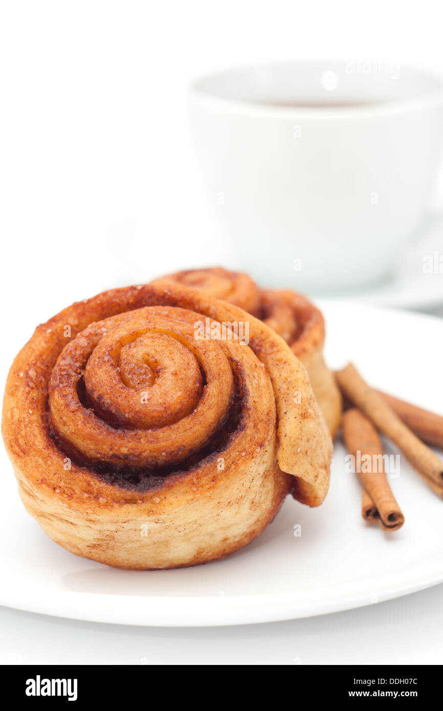 Homemade cinnamon rolls, cup of tea, white background Stock Photo - Alamy