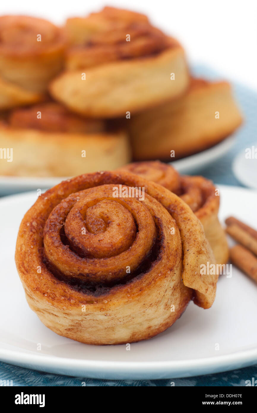 Cinnamon rolls group on white plate Stock Photo - Alamy