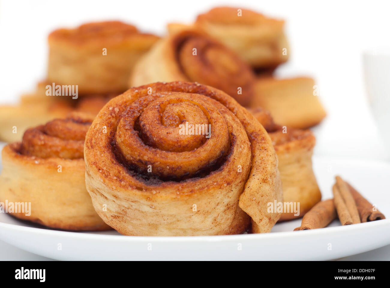 Cinnamon rolls group on the plate, white background Stock Photo - Alamy