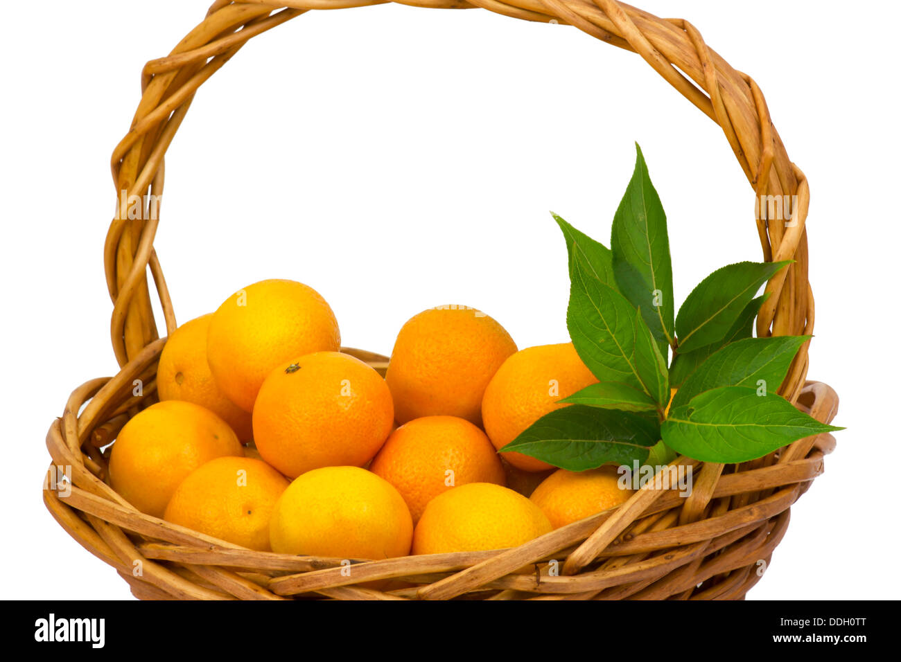 tangerines in a basket on white background Stock Photo - Alamy