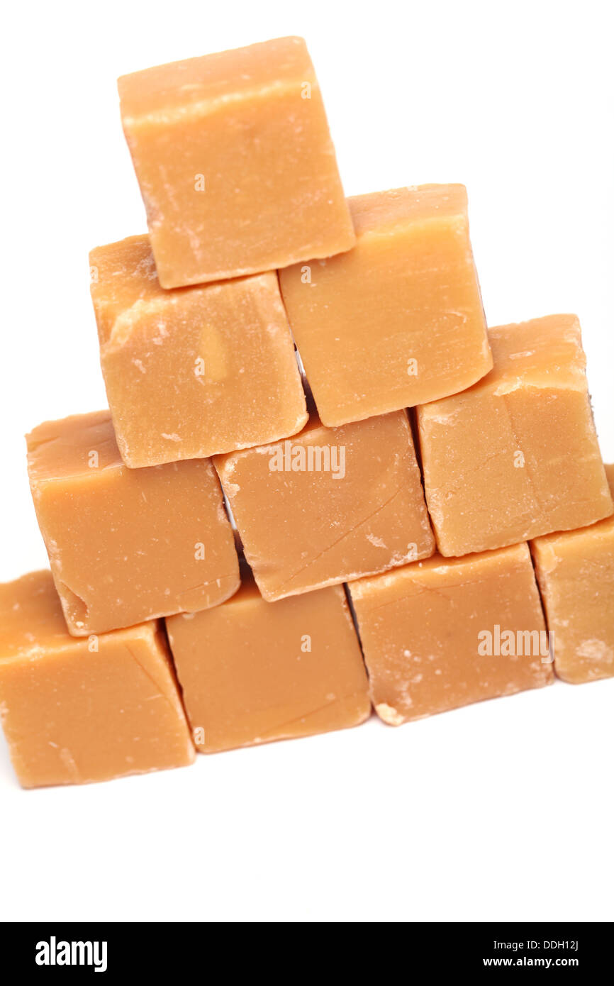 Tasty brown butterscotch on a white background Stock Photo - Alamy