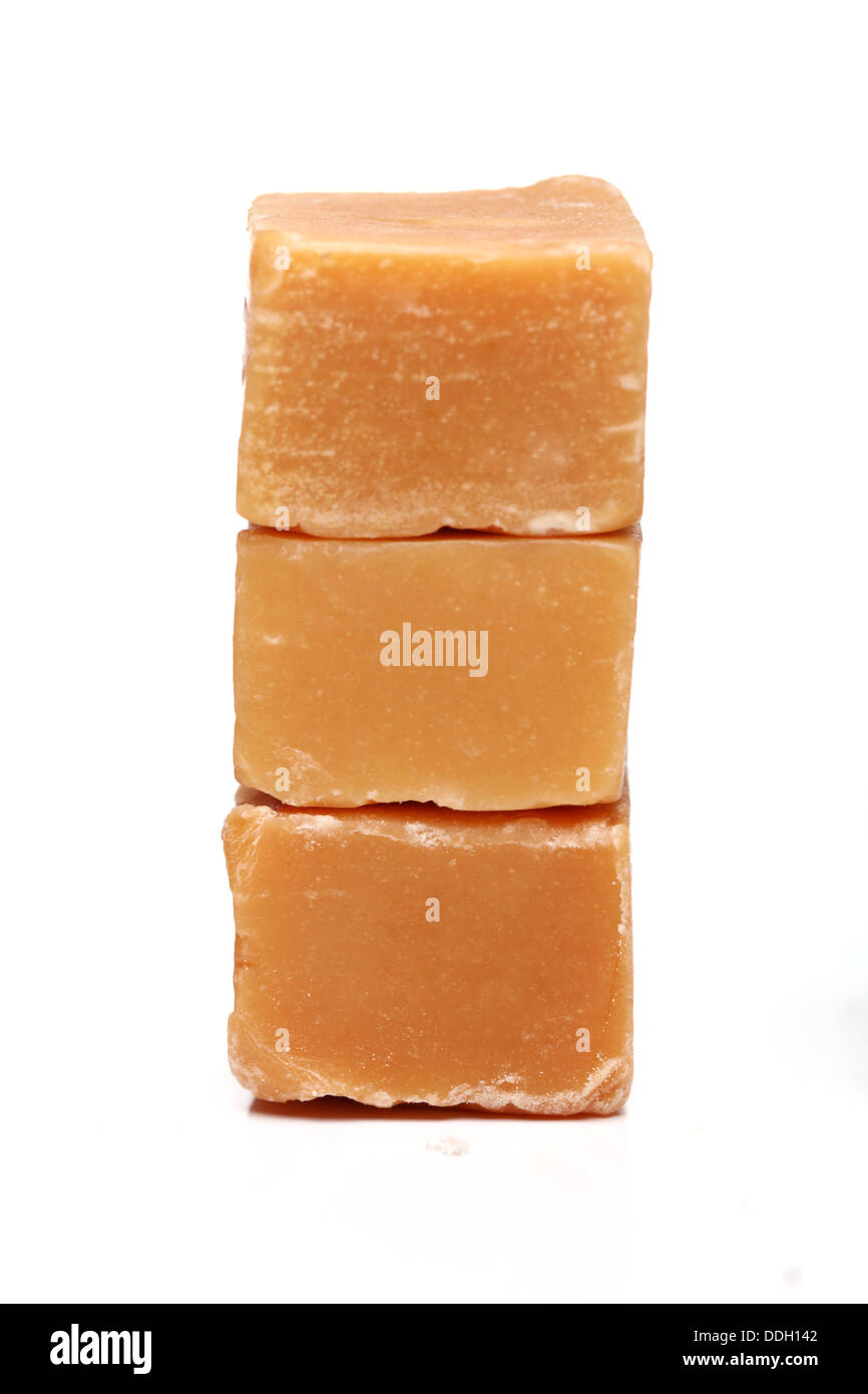 Tasty brown butterscotch on a white background Stock Photo - Alamy