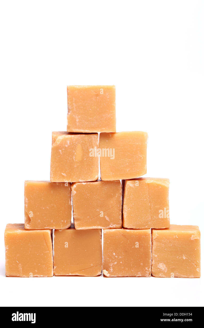 Tasty brown butterscotch on a white background Stock Photo - Alamy