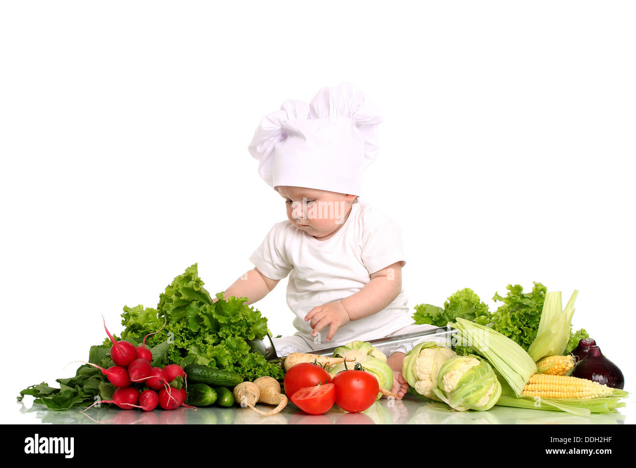 Baby cook with fresh vegetables on a white Stock Photo - Alamy