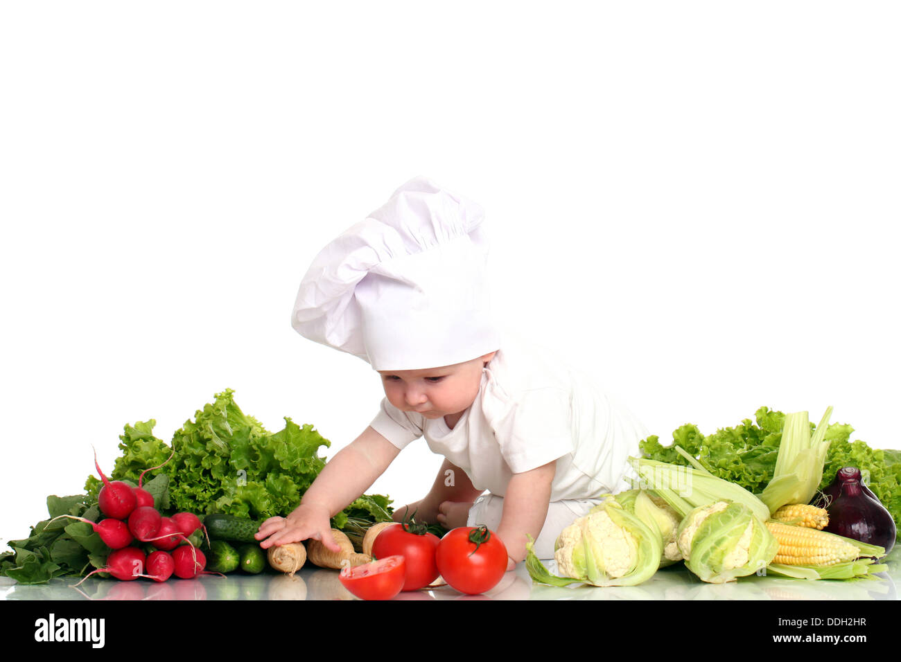 Baby cook with fresh vegetables on a white Stock Photo - Alamy