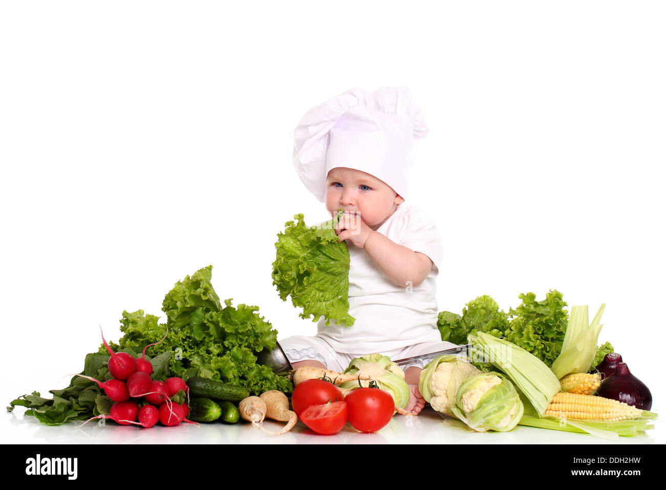 Baby cook with fresh vegetables on a white Stock Photo - Alamy