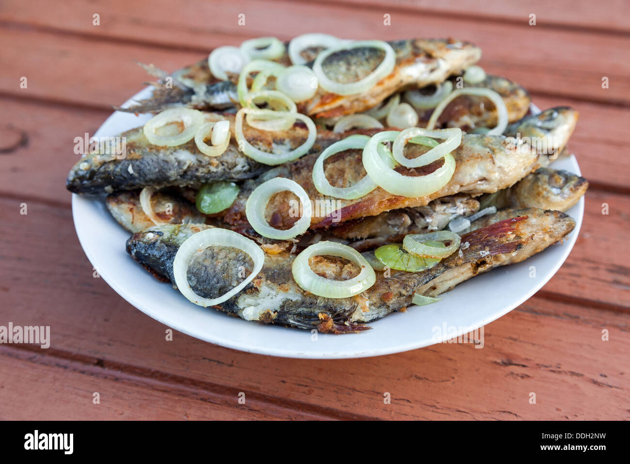 Fried fish on a plate Stock Photo - Alamy