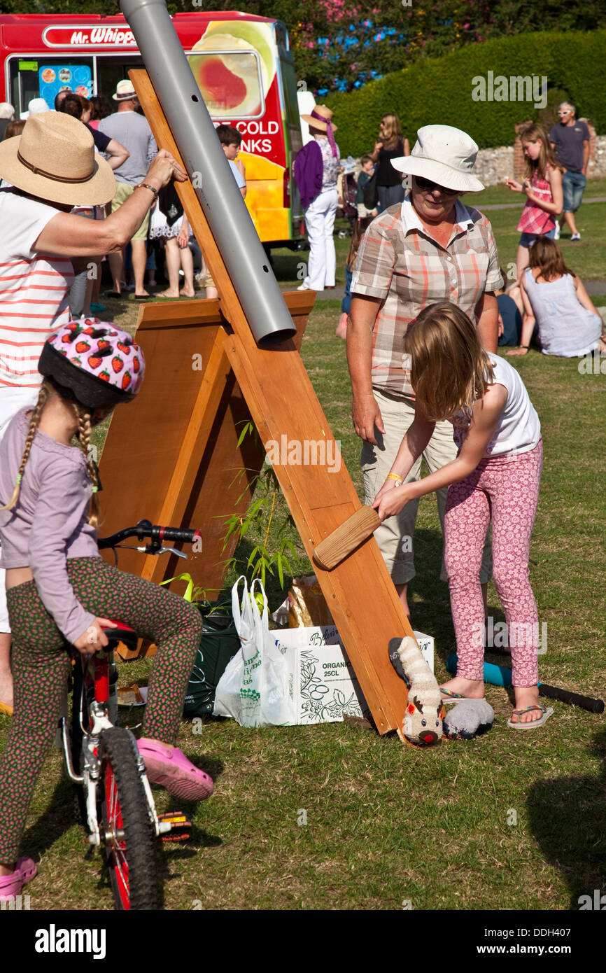 A Child Playing 'Splat The Rat', The Alfriston Festival, Sussex ...