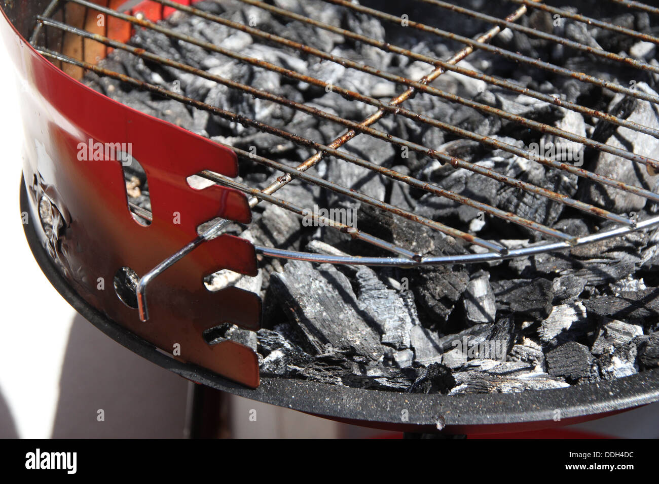 detail of portable small round barbecue grill in garden Stock Photo - Alamy