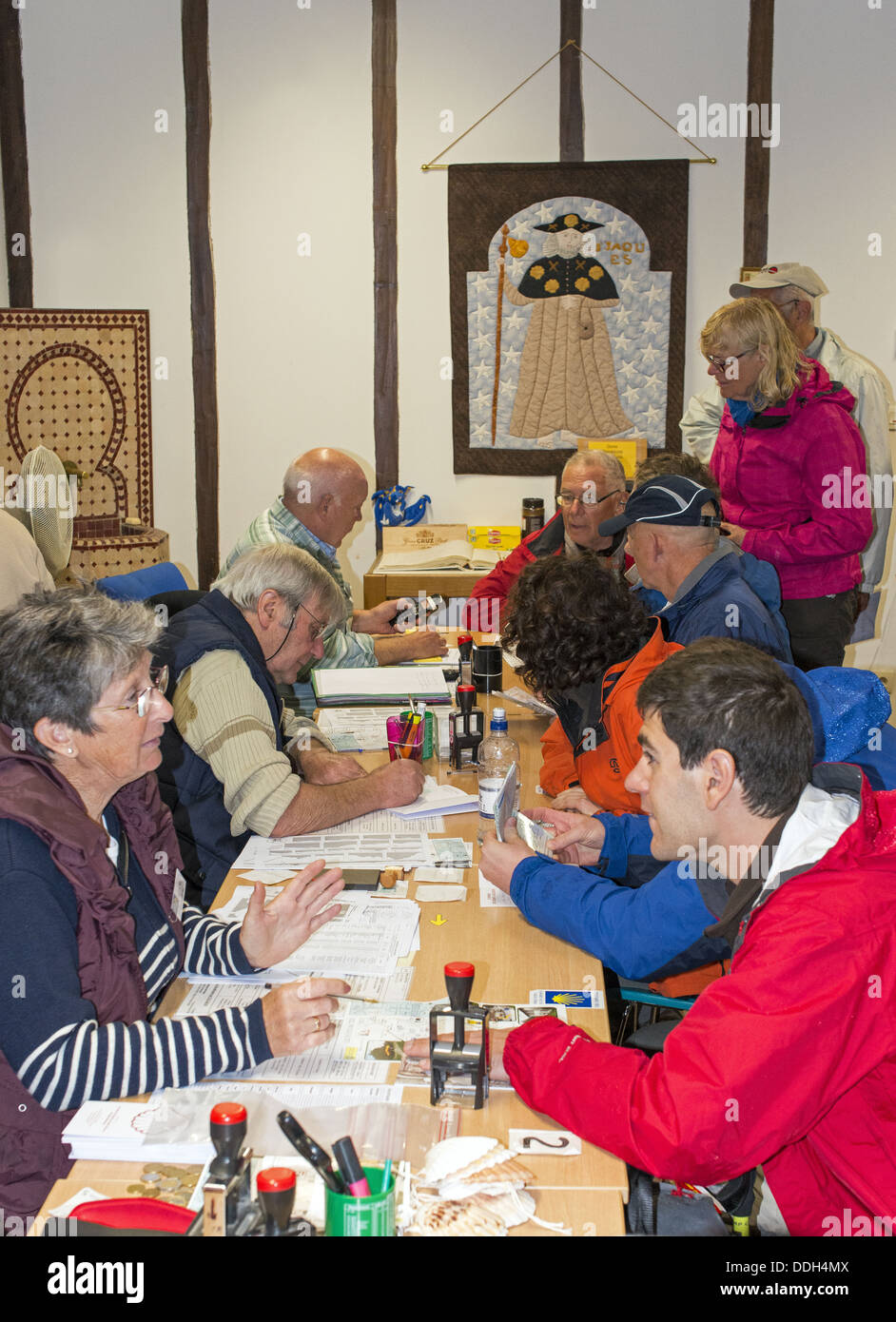 Pilgrims getting their passport from the pilgrim office for the Camino ...
