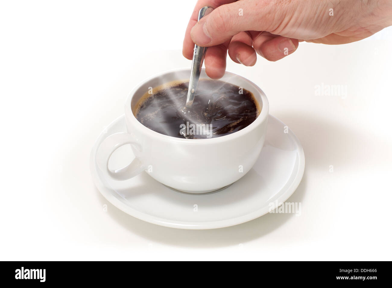 Hand stiring a white cup of coffee on a white isolated background Stock ...