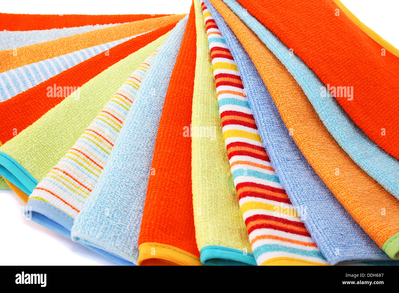 Colorful towels on white background Stock Photo - Alamy