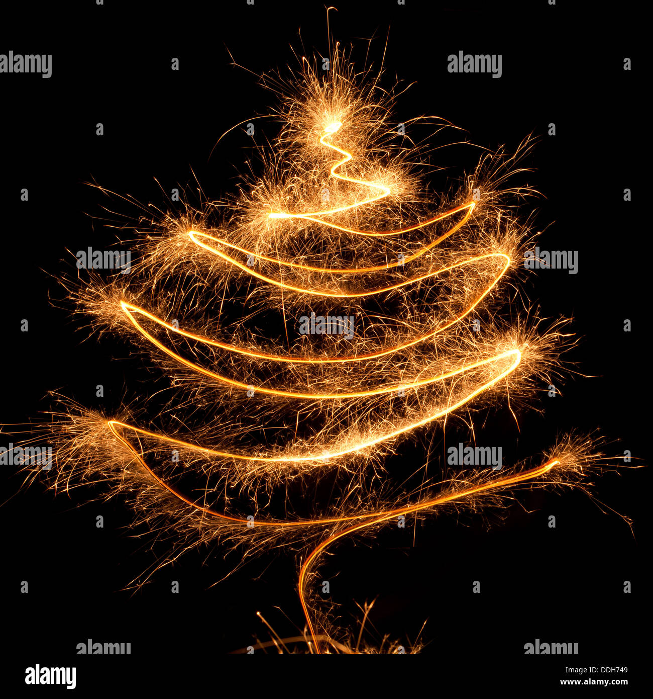 Fir tree of burning christmas sparkler on black background. Beng Stock ...