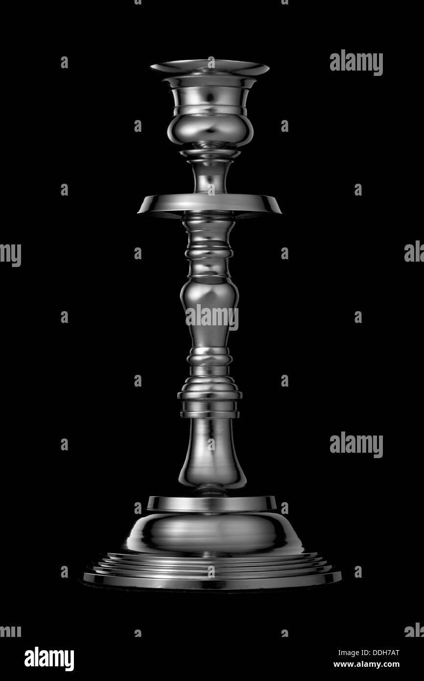 Silver candlestick isolated on black background Stock Photo - Alamy
