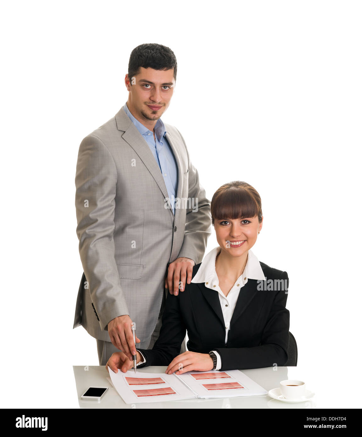 Two business people looking documents Stock Photo - Alamy