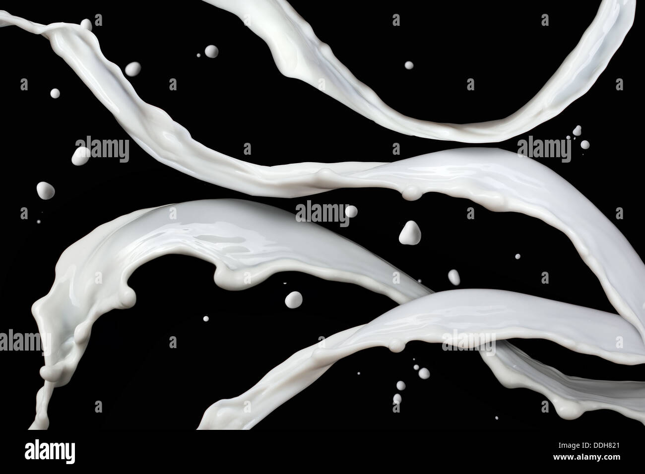 milk splash isolated on black background Stock Photo - Alamy