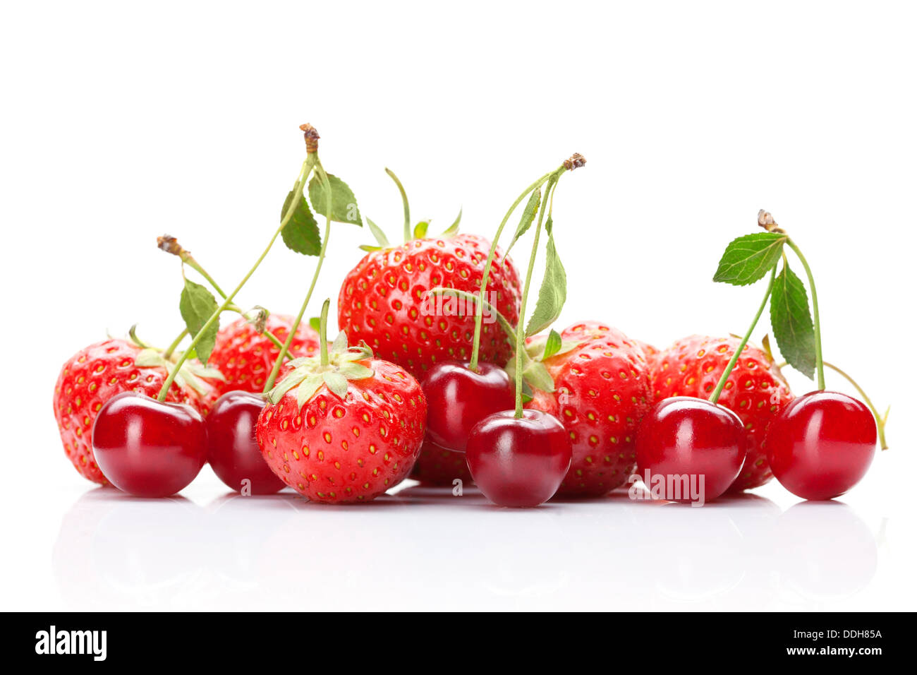Strawberry and cherry isolated on white Stock Photo - Alamy
