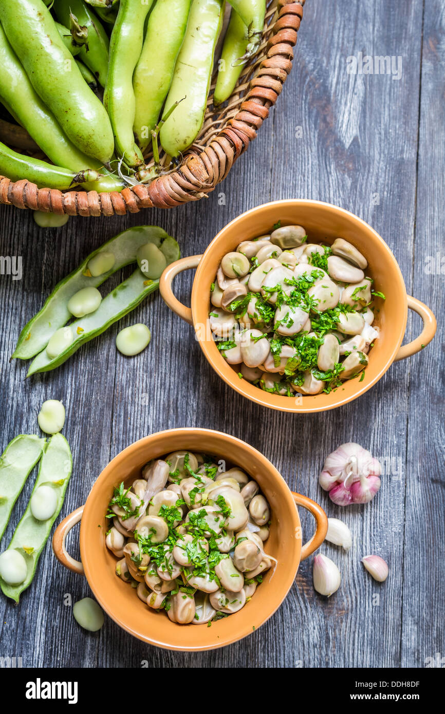 Fresh broad beans served with parsley and garlic Stock Photo - Alamy