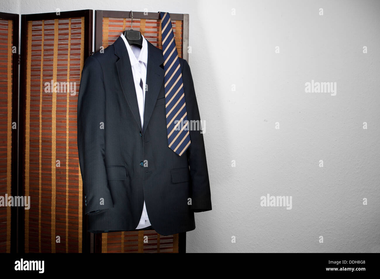 Suit jacket hanging on office hi-res stock photography and images - Alamy
