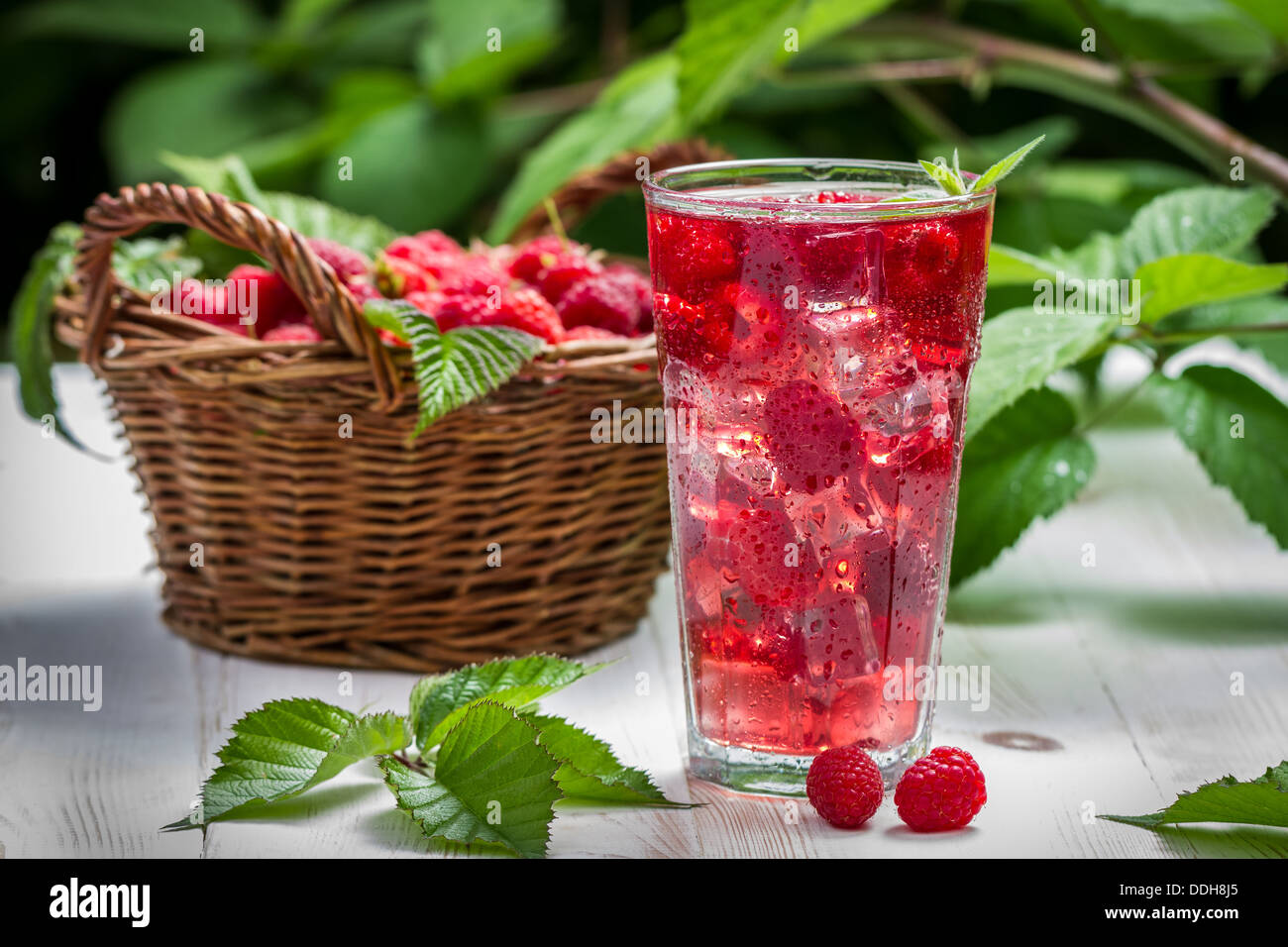 Juice from freshly harvested raspberries Stock Photo - Alamy