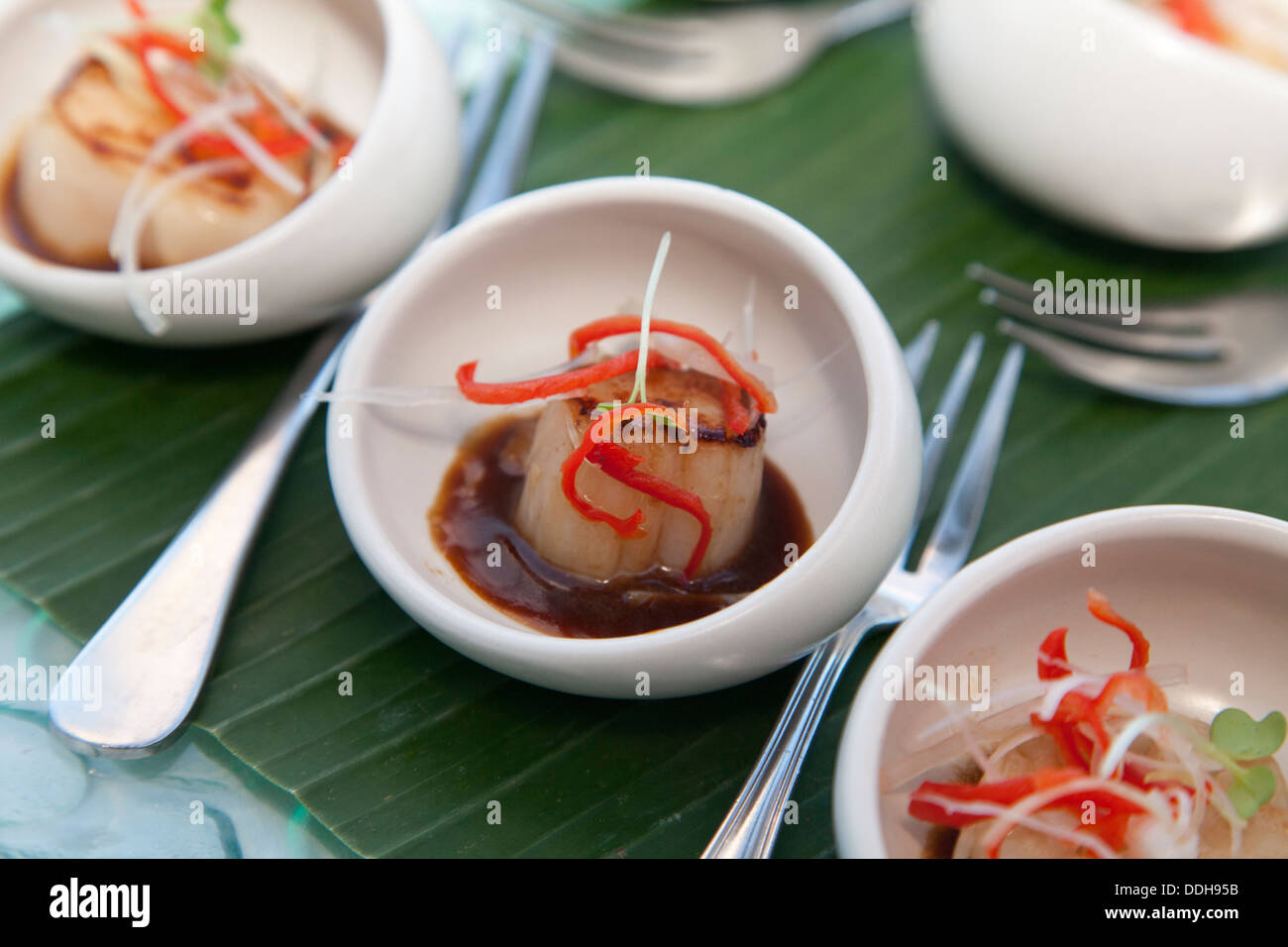 Exotic design fingerfood served in restaurant based on small pieces of ...