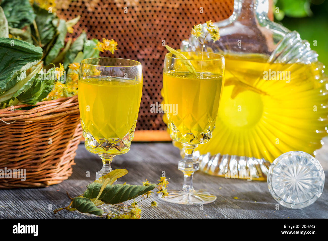 Homemade liqueur made of honey and dry lime leaves Stock Photo - Alamy