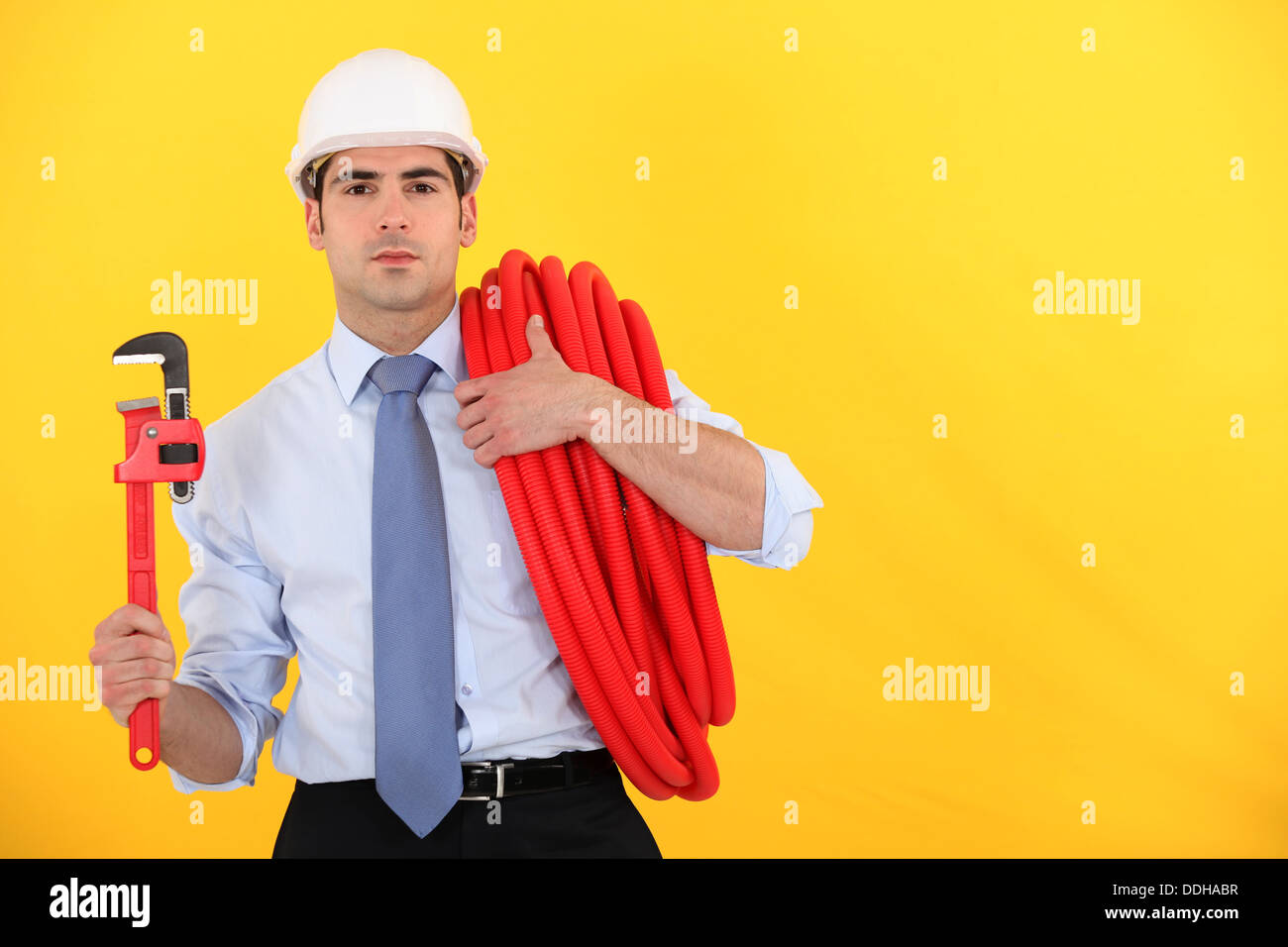 Man in a suit with plans Stock Photo - Alamy