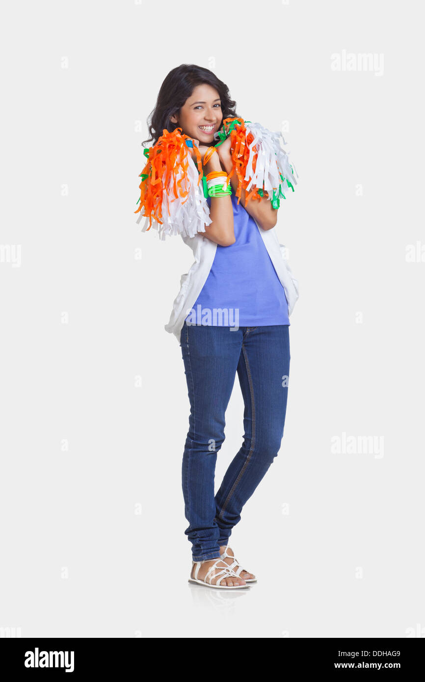 Full length portrait of young female in casual wear holding Indian ...