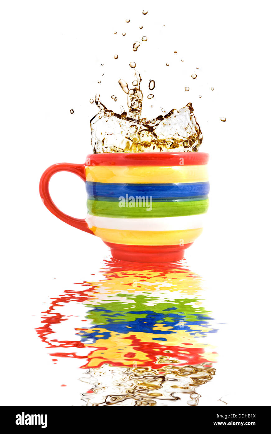 splash of tea in color cup with reflection Stock Photo - Alamy