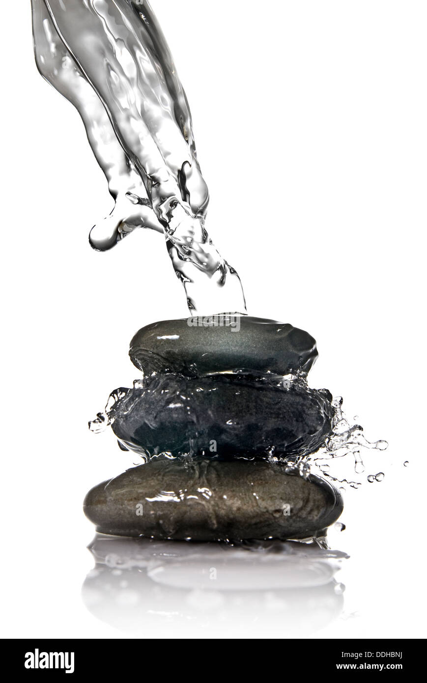 Spa stones with water splash isolated on white Stock Photo - Alamy