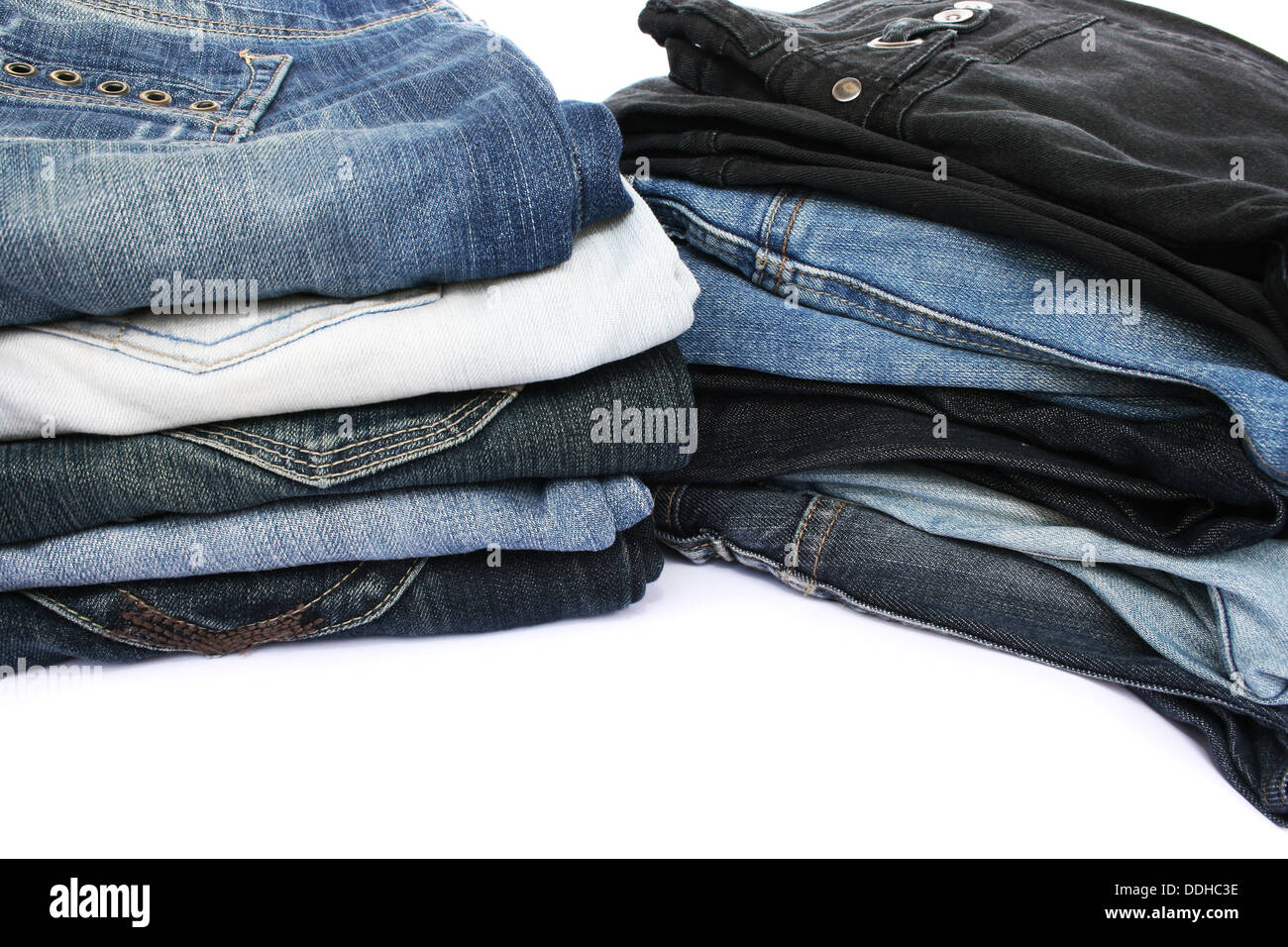 Stack of colorful jeans isolated on white background Stock Photo - Alamy