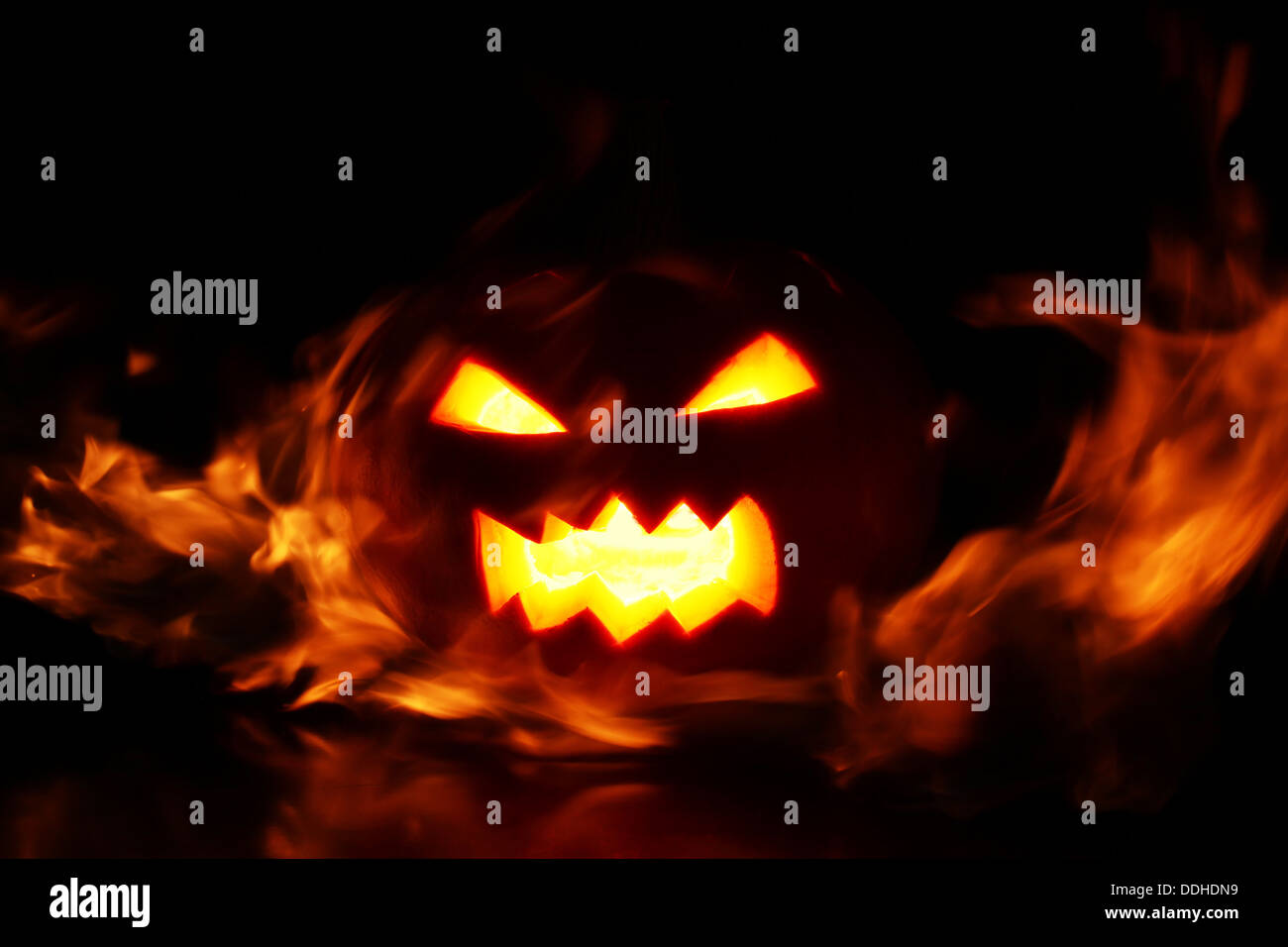 Halloween pumpkin in fire Stock Photo - Alamy