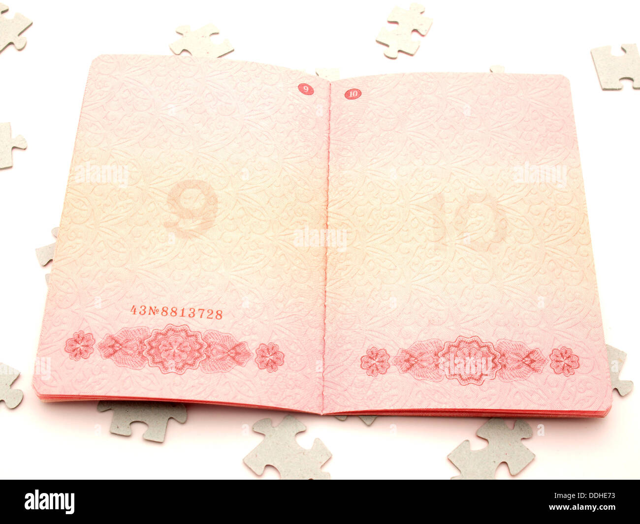 The passport and puzzle on a white background Stock Photo - Alamy