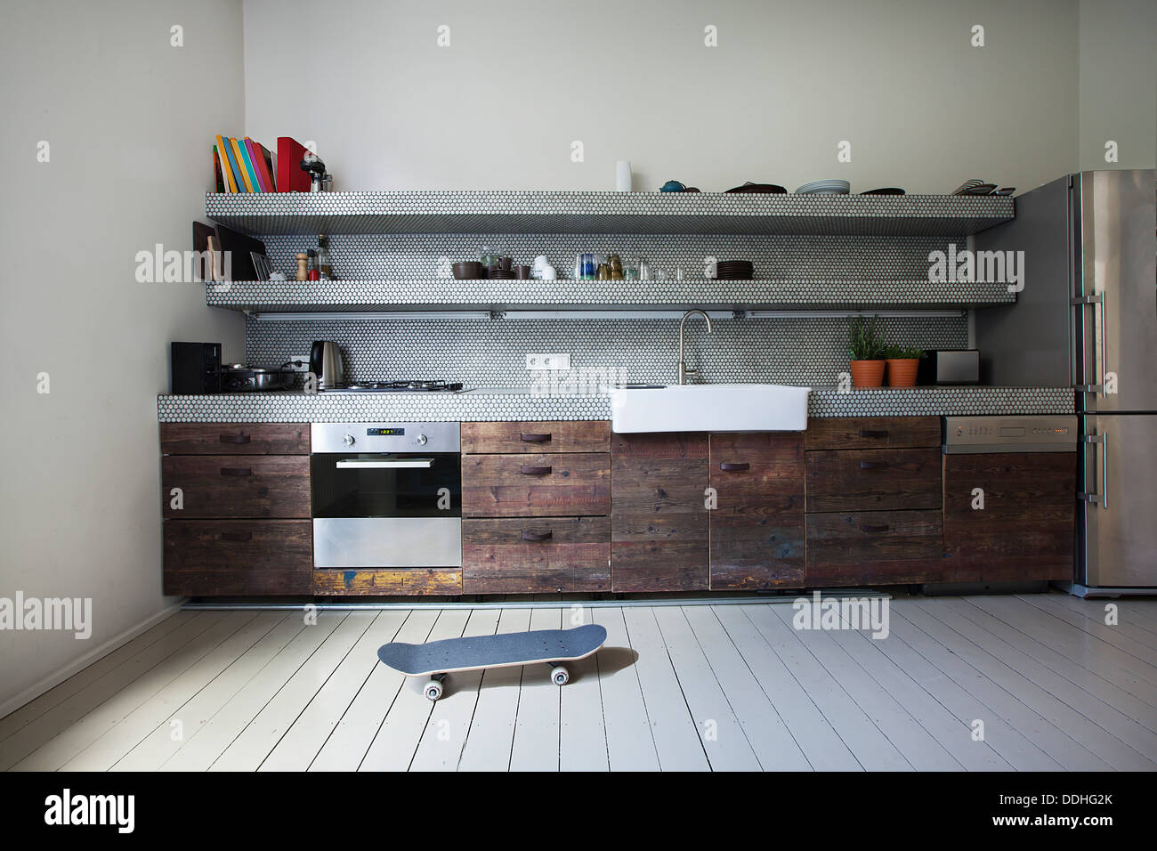 Interior of kitchen with skateboard Stock Photo - Alamy