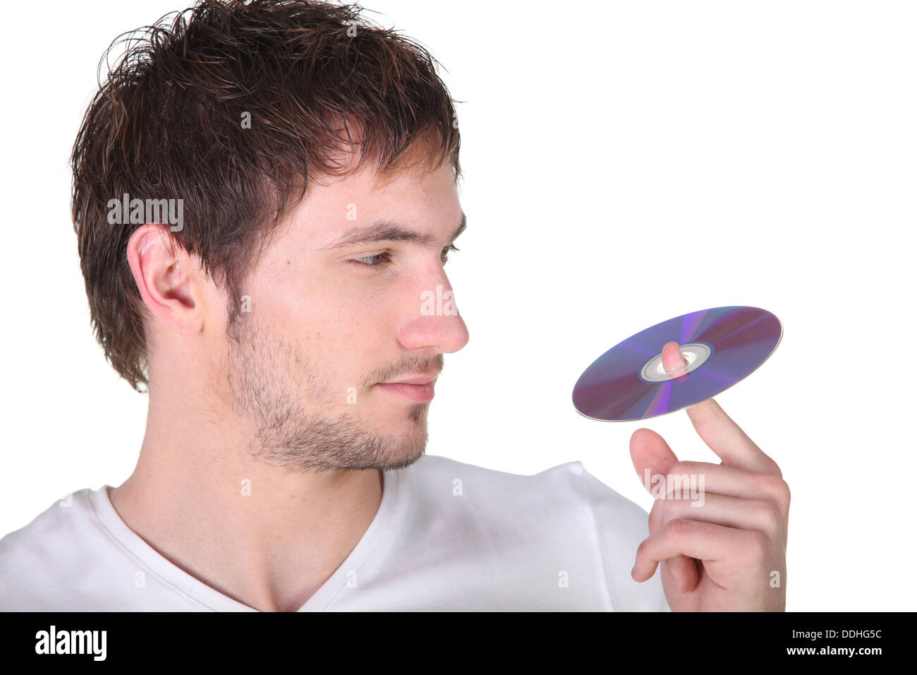 Young man spinning a digital recording disc on his finger Stock Photo ...