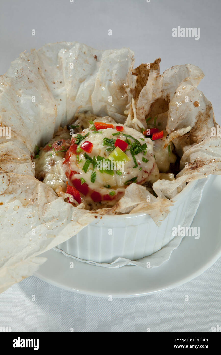Beef meat cooked in clay pot in oven served in same pot with melted ...