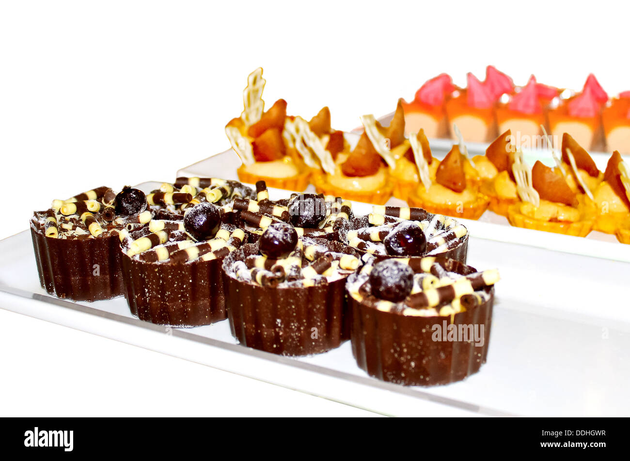 Various cakes on white background Stock Photo - Alamy