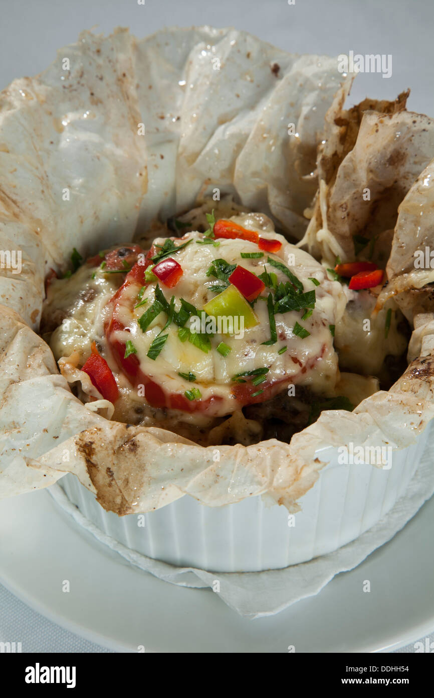 Beef meat cooked in clay pot in oven served in same pot with melted ...