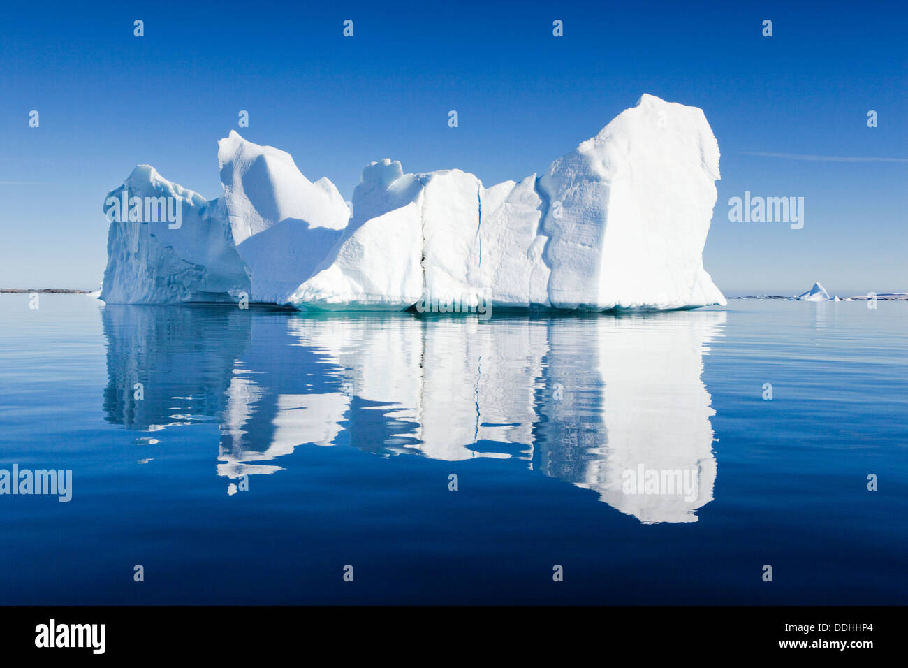 Iceberg with reflections in the water Stock Photo - Alamy