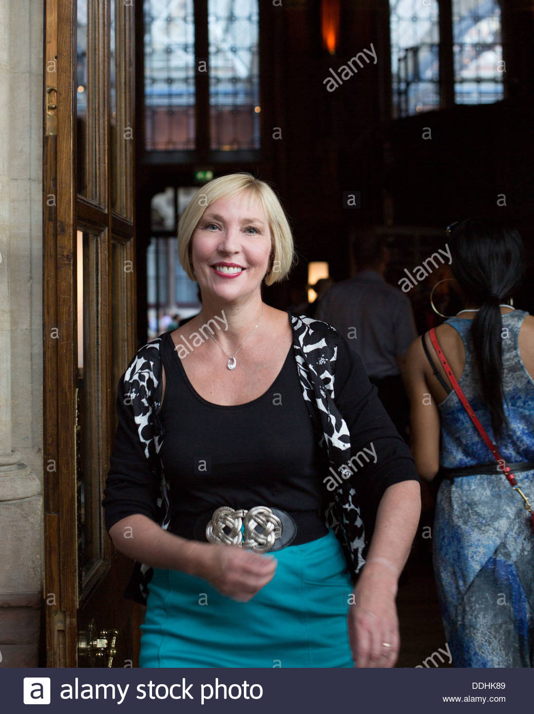 Woman Walking Out Of The Door Stock Photos & Woman Walking Out Of The ...