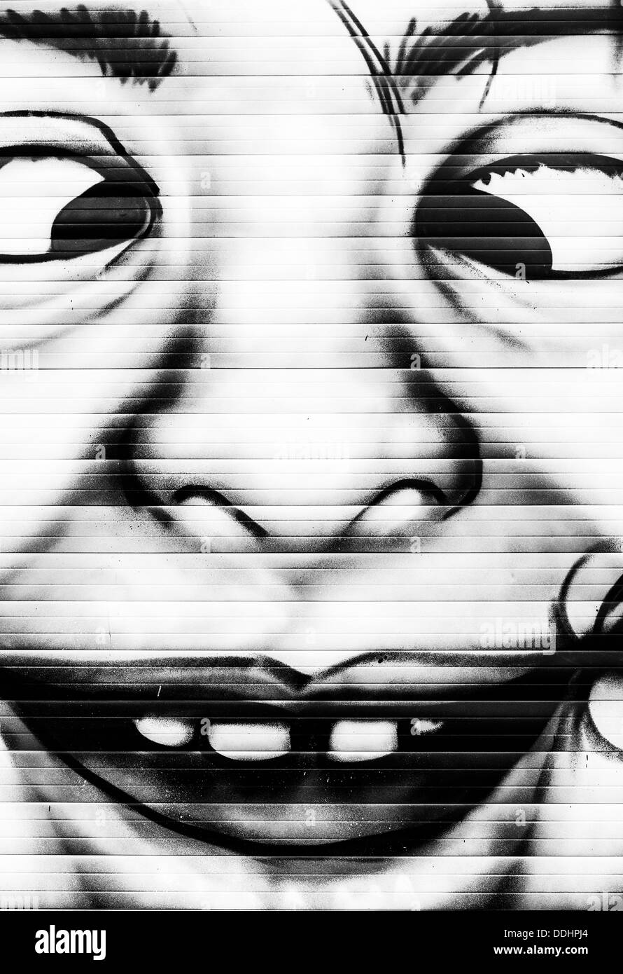 Artistic graffiti on a shutter Stock Photo - Alamy