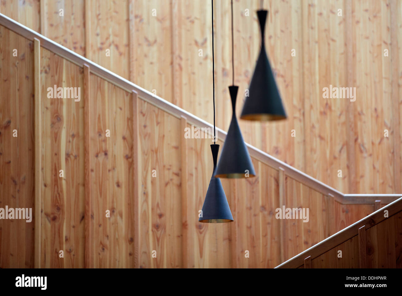 Abstract lamp shades hanging over a staircase Stock Photo - Alamy