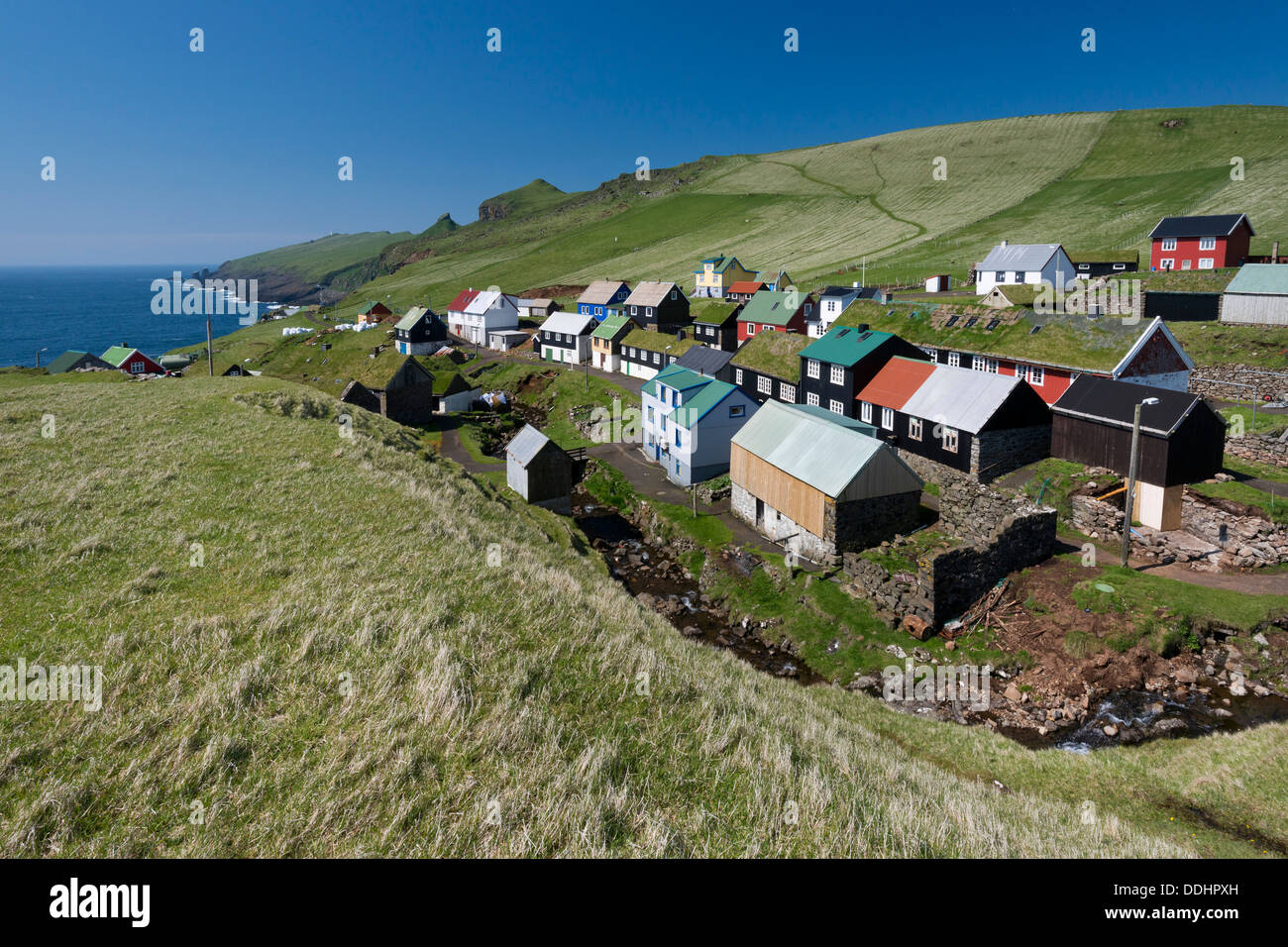 Village with houses mostly in the traditional Faroese style, wood on a ...