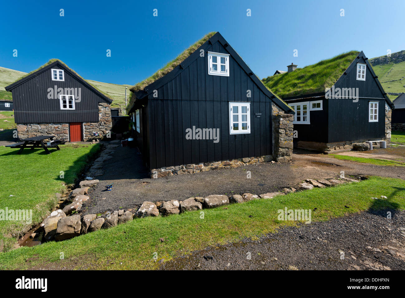 Black houses, tarred, with white window frames, traditional Faroese ...