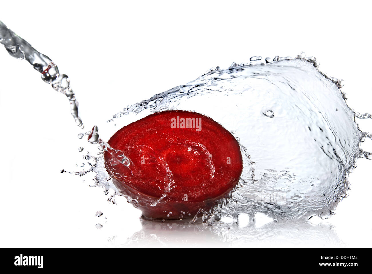 red beet with water splash isolated on white Stock Photo - Alamy