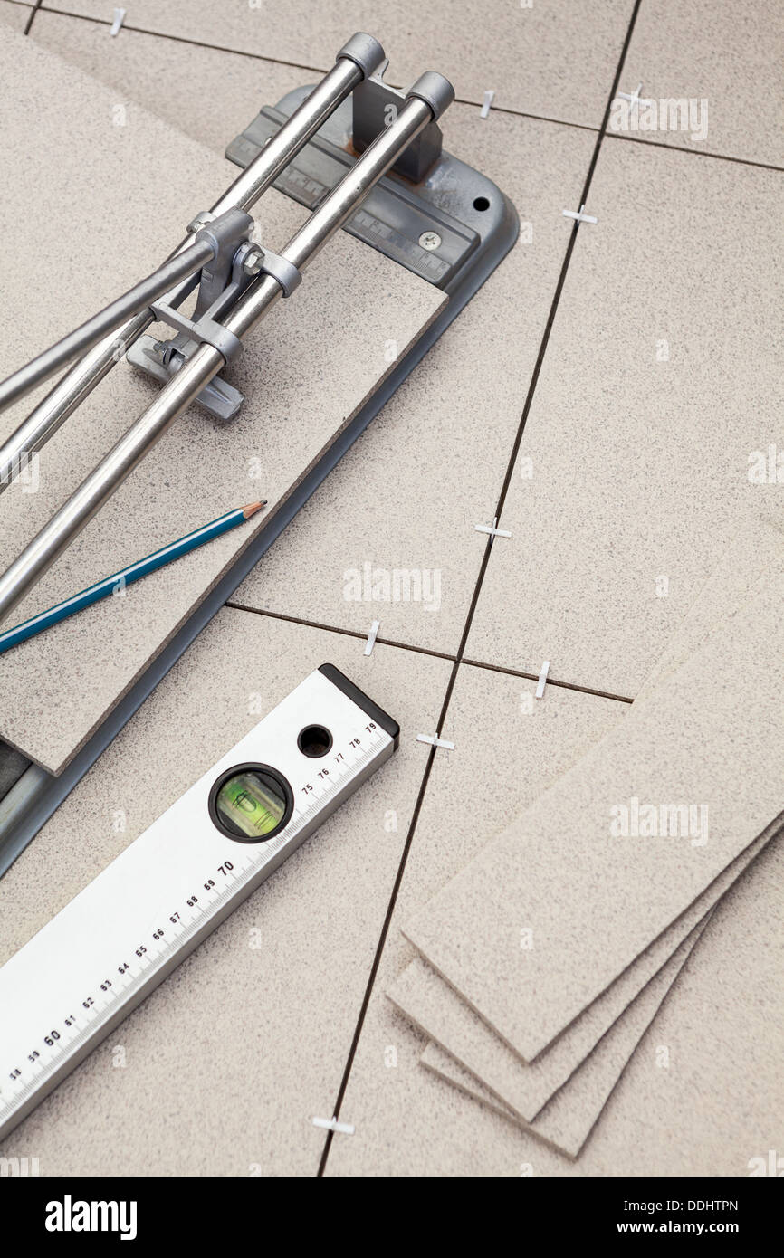 Tools for installing the floor from a ceramic tiles Stock Photo - Alamy