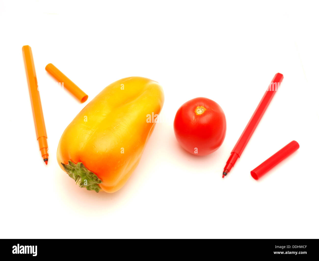Vegetables and felt-tip pens on a white background Stock Photo - Alamy