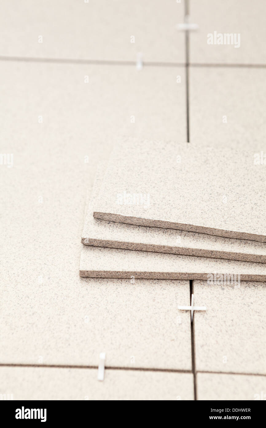 Pre-laying tiles on the floor Stock Photo - Alamy