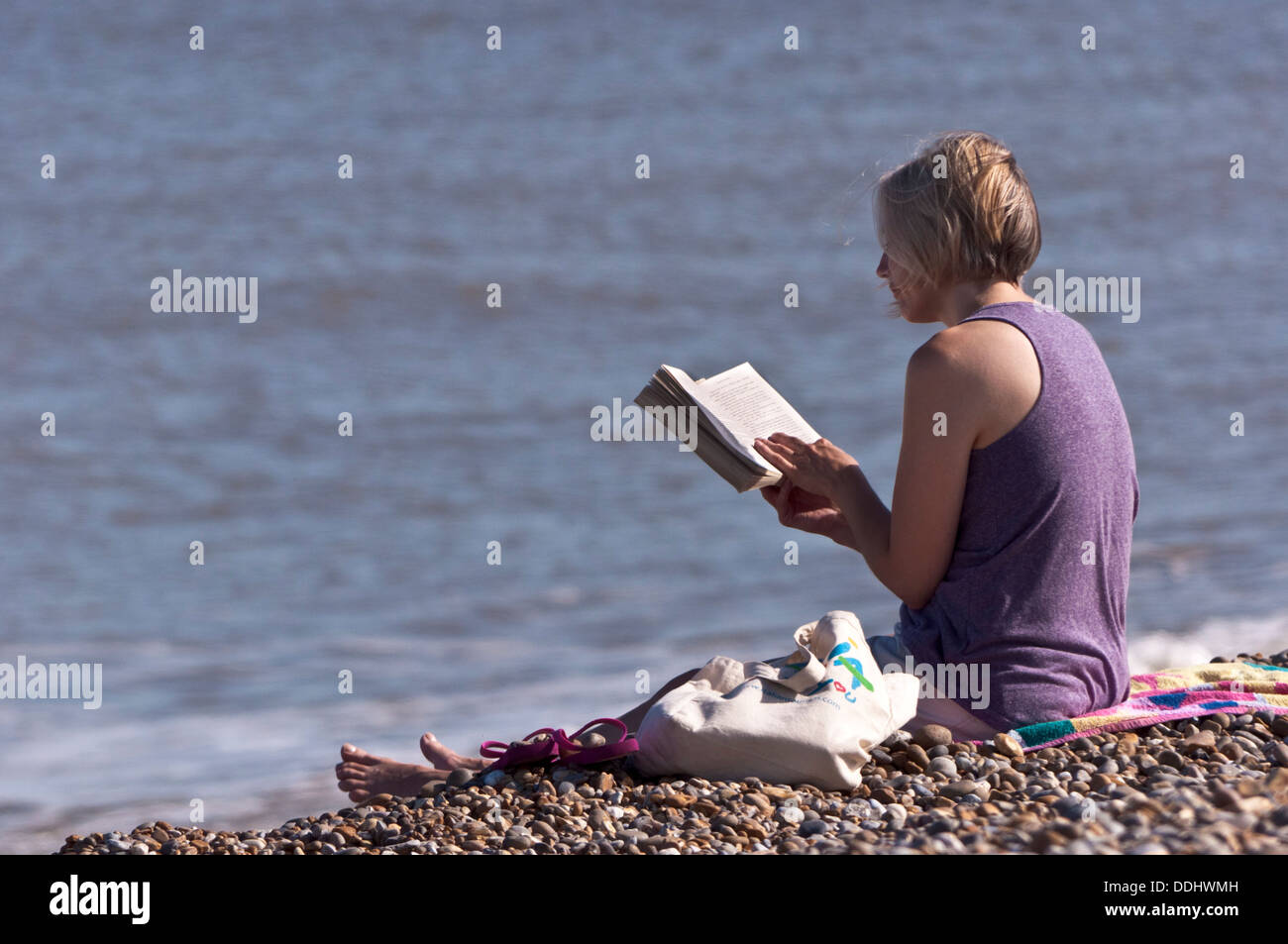 Woman on holiday beach hi-res stock photography and images - Alamy