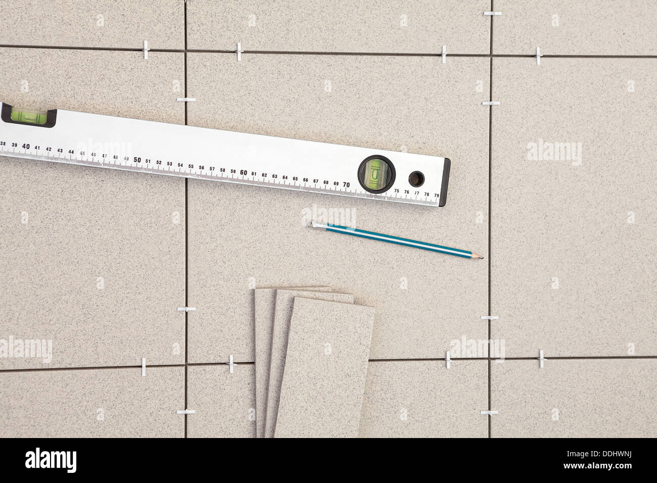 Tiles laying works Stock Photo - Alamy